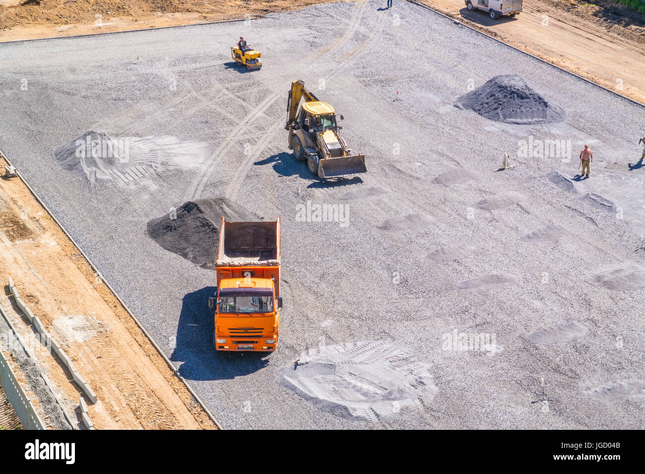 The construction of the school stadium. Excavator, dumper, roller Stock ...