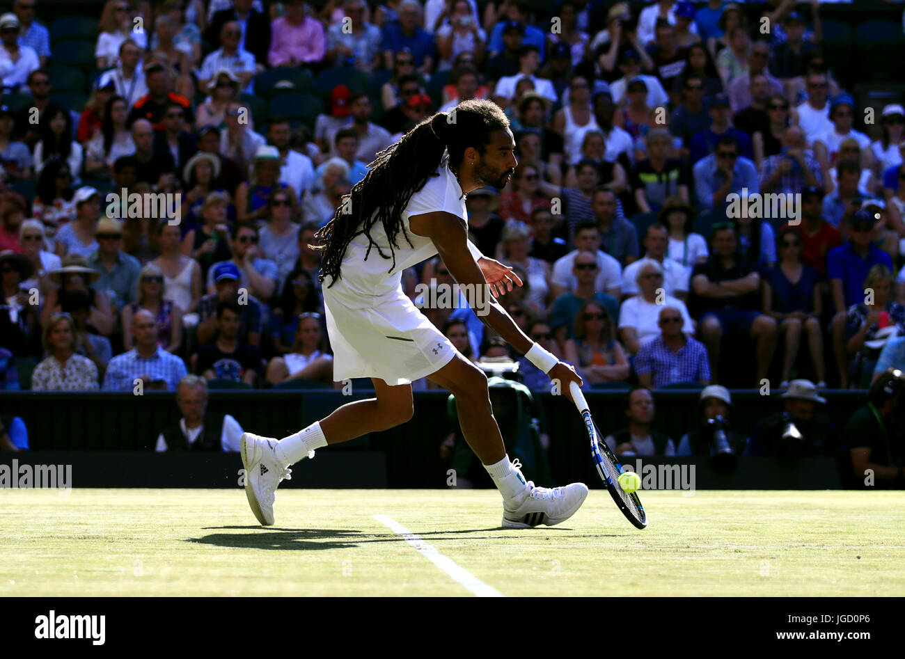 Dustin Brown in action against Andy Murray on day three of the ...