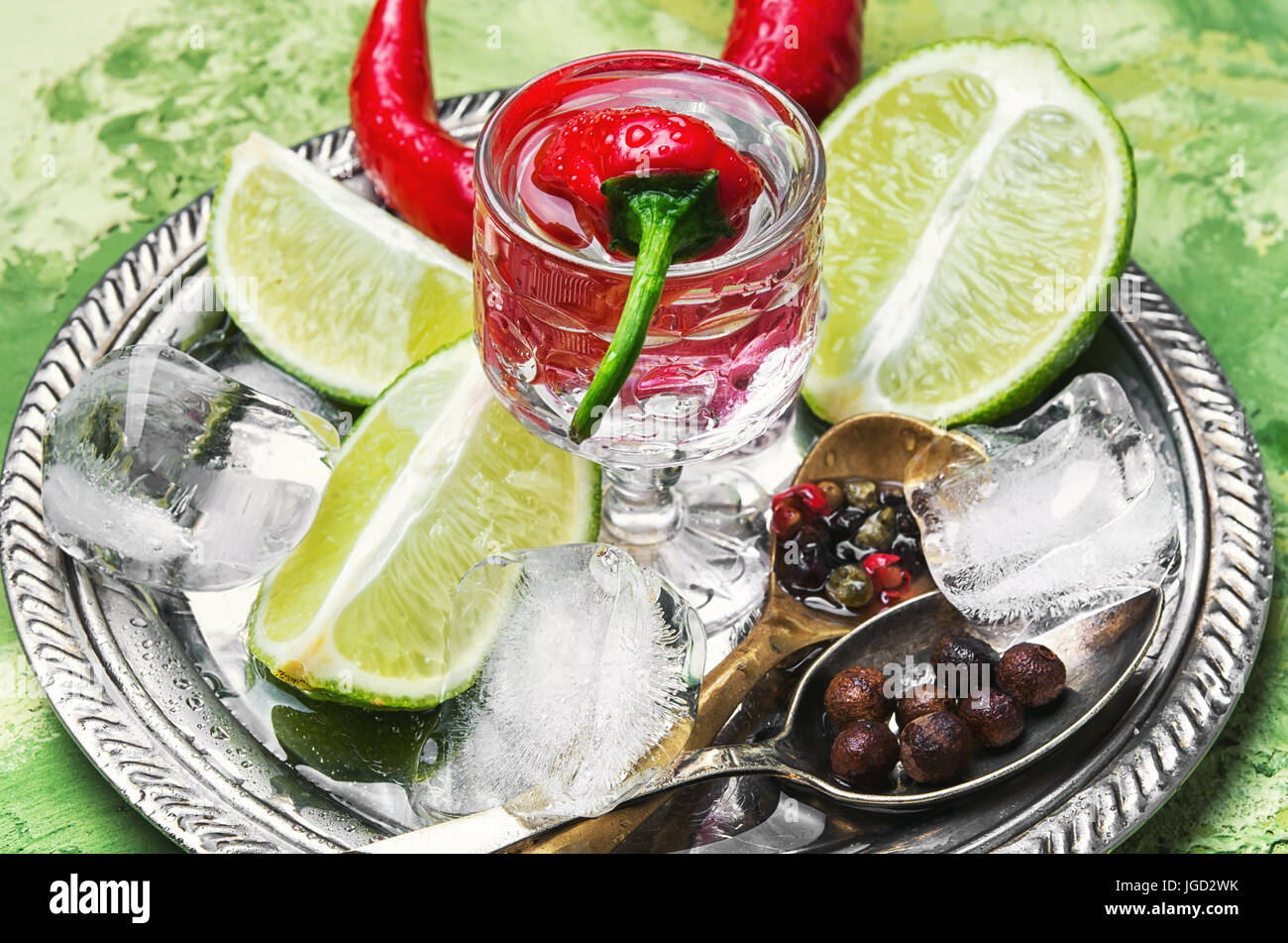 glass of pepper vodka and red mexican chili pepper Stock Photo - Alamy