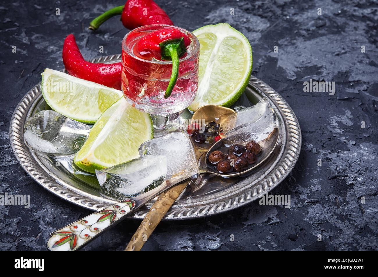 glass of pepper vodka and red mexican chili pepper Stock Photo - Alamy