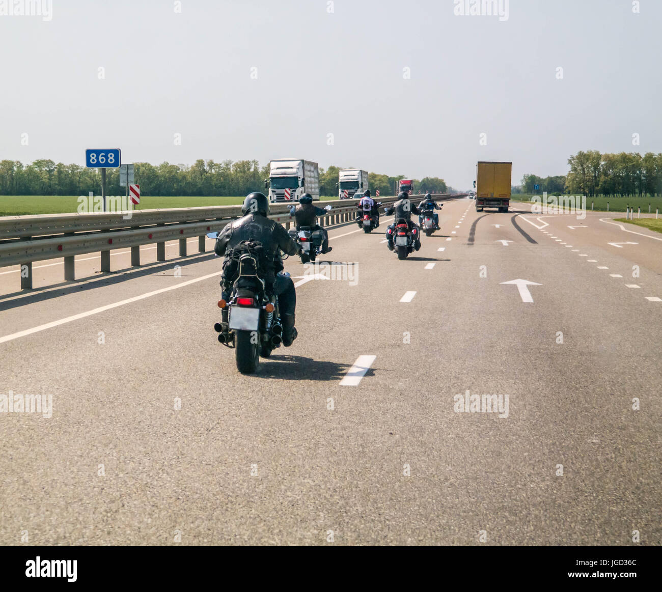 Rider driving bike along road hi-res stock photography and images - Alamy