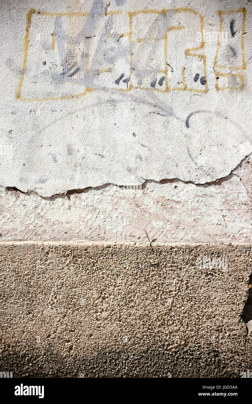 The closeup of chipped plaster layers on the surface of a wall Stock ...