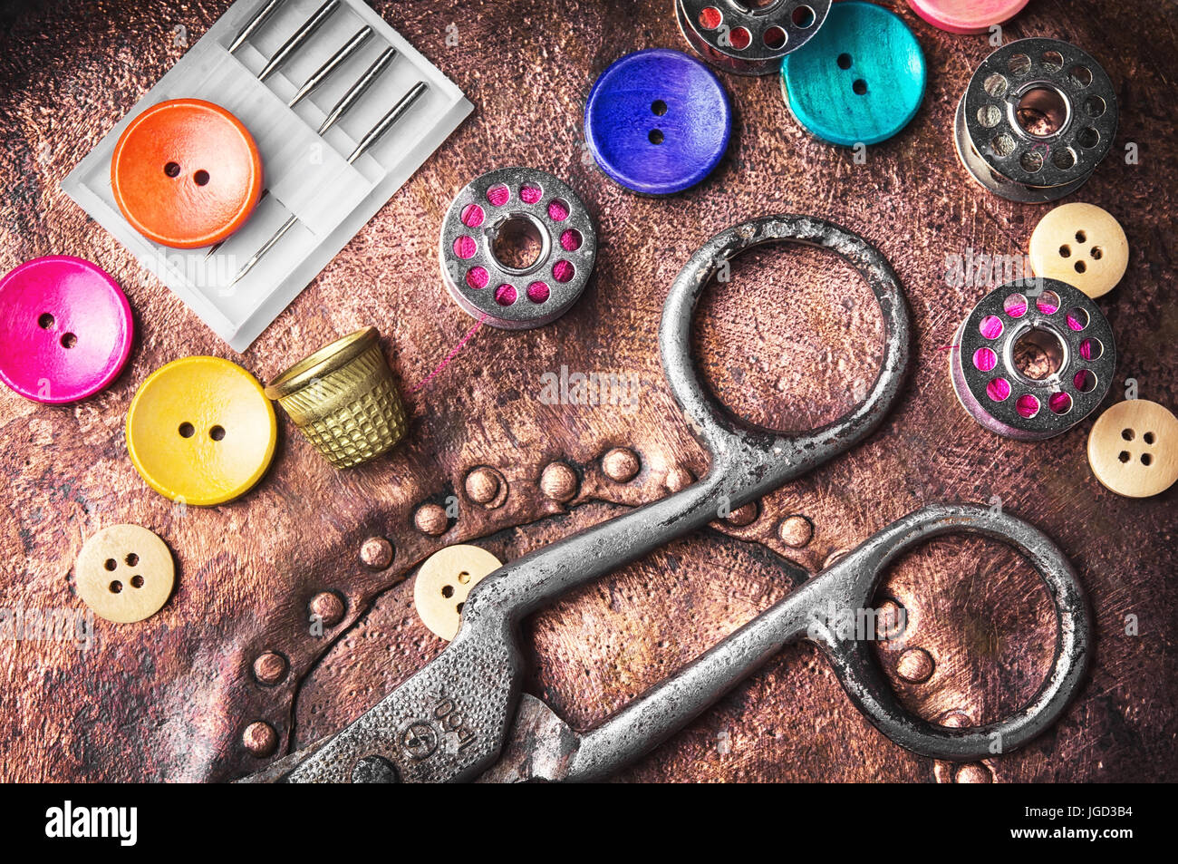 Multi-colored plastic sewing button and thread coil Stock Photo - Alamy