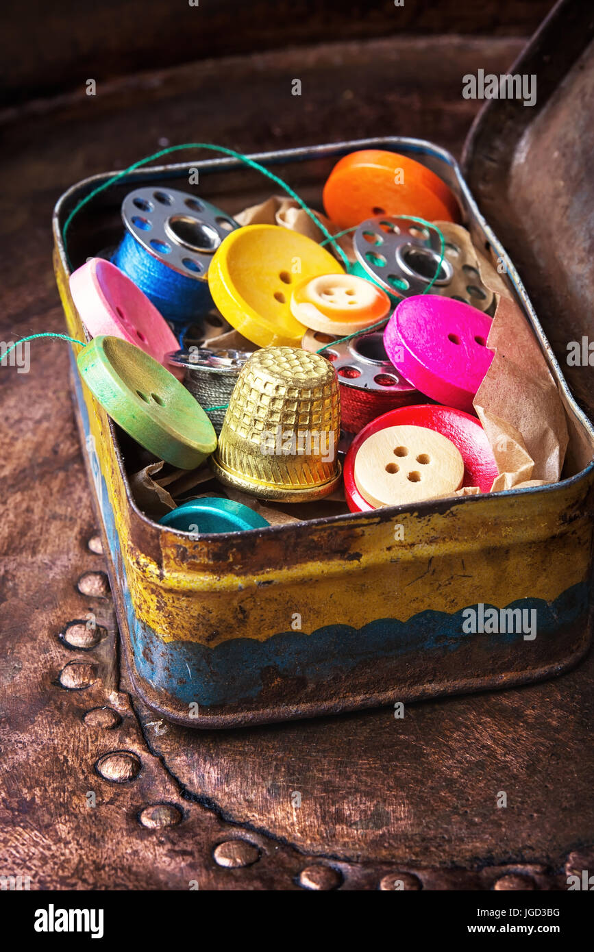 Old-fashioned metal box with buttons and threads Stock Photo - Alamy