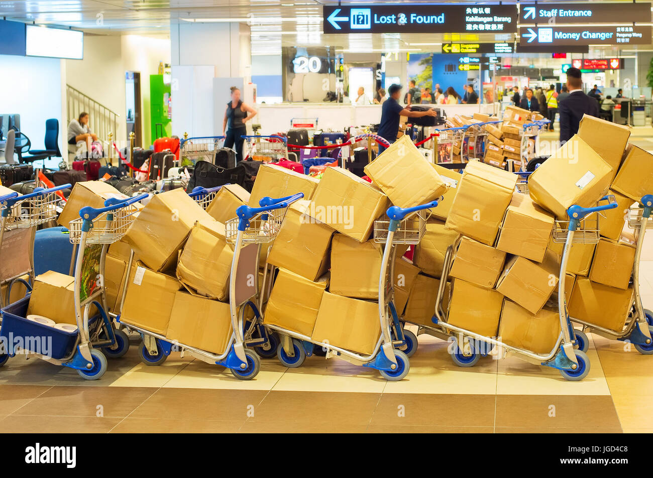 Lots of cardboard boxes on a trolleys at airport terminal Stock Photo ...
