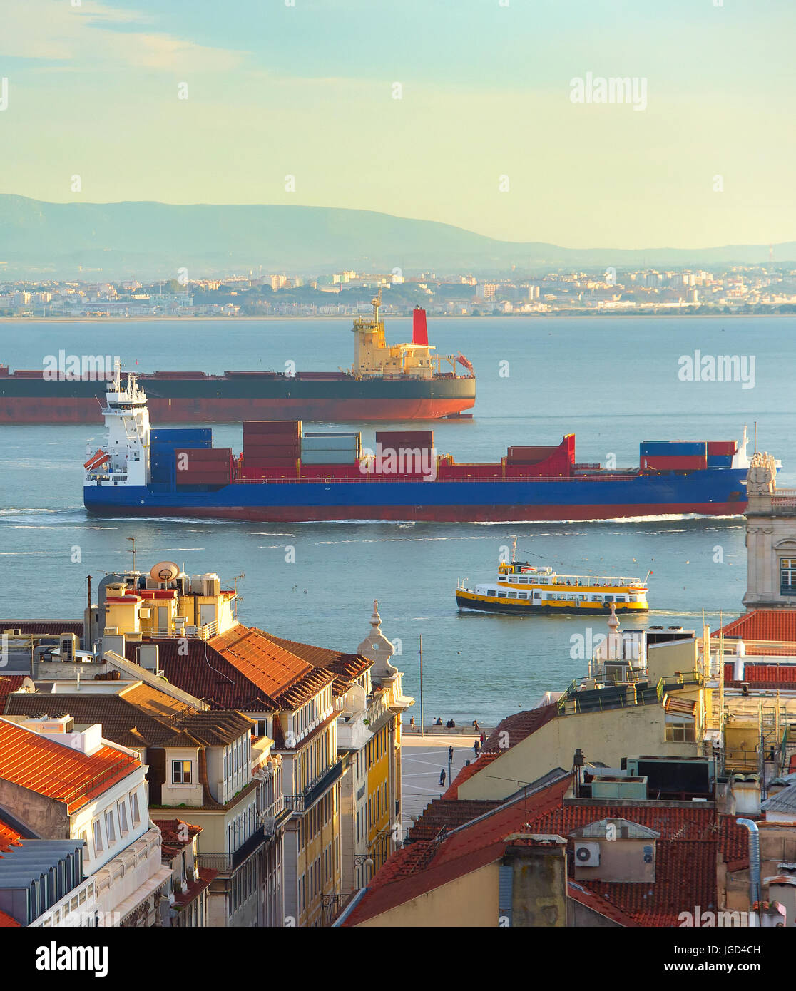 Ships on the Tagus river in Lisbon harbor at sunset. Portugal Stock Photo - Alamy