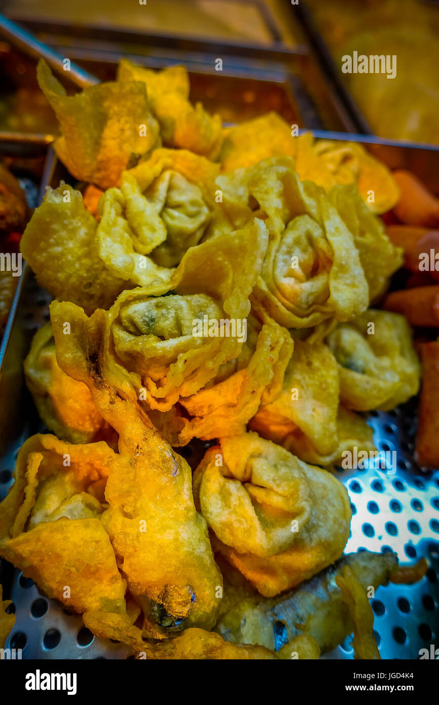 Tasty fried food on a street kitchen in Asia, fresh vegetables in Hong ...