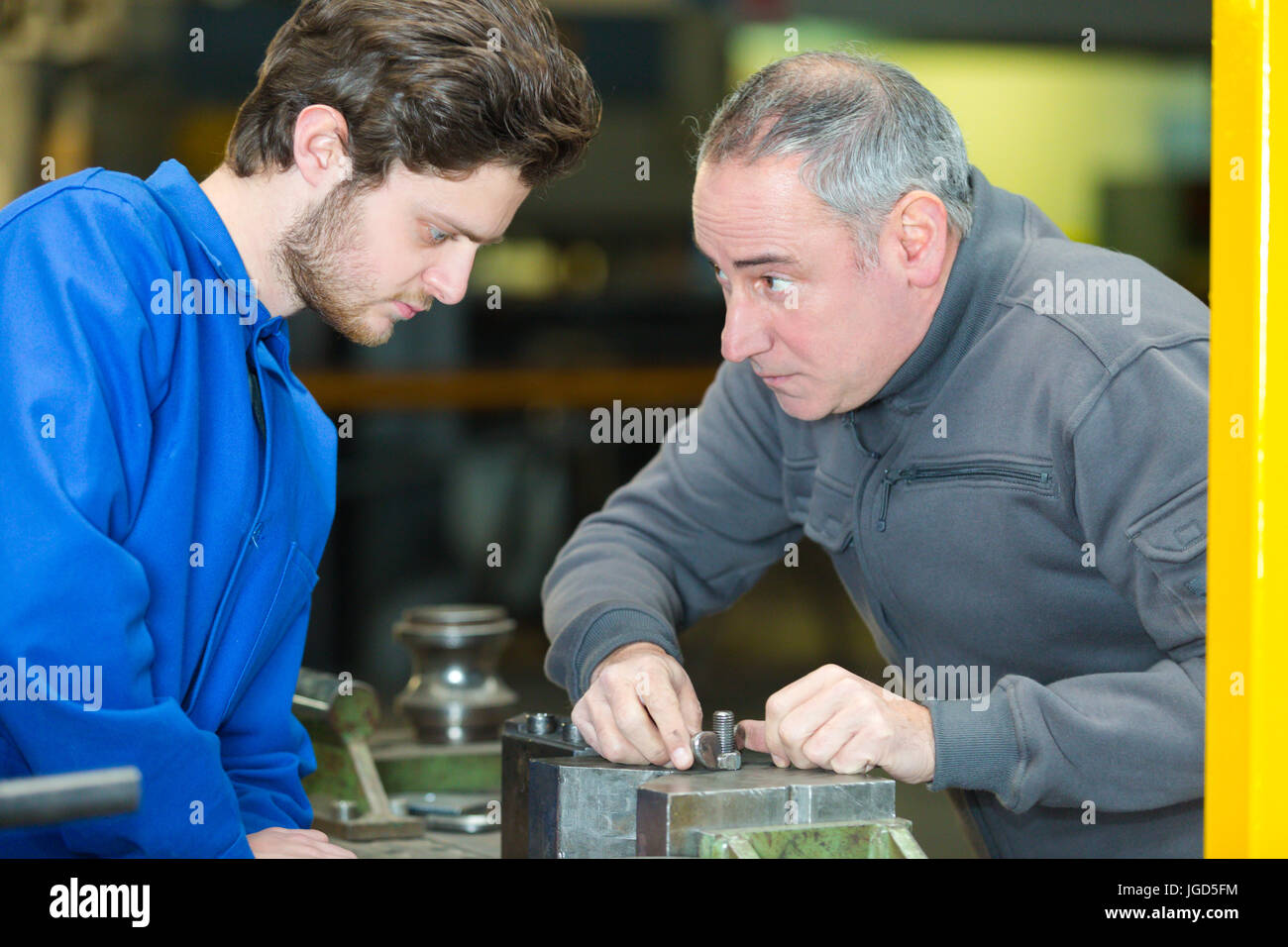 young metal worker Stock Photo - Alamy