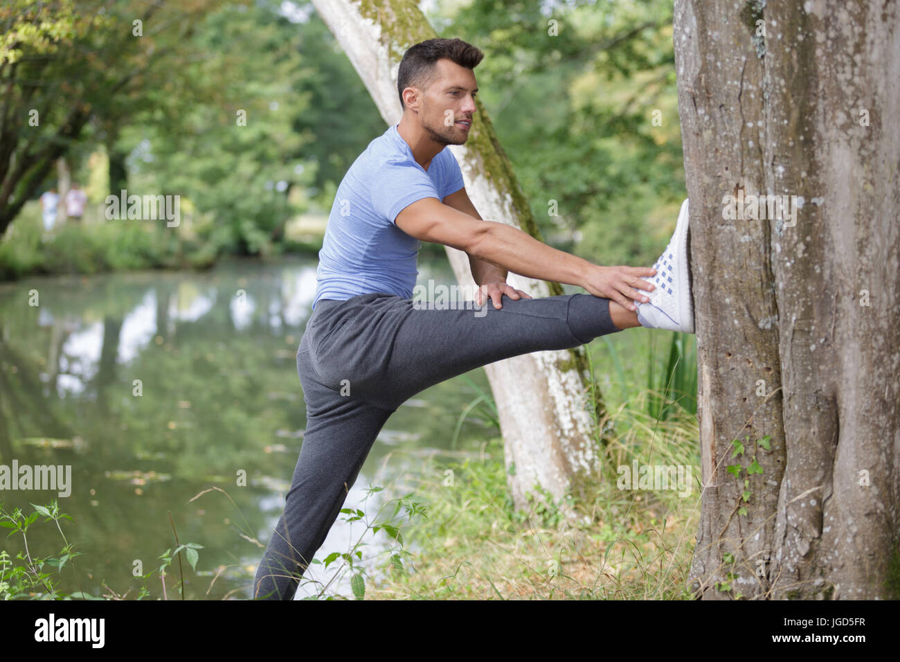handsome man stretching outdoor Stock Photo - Alamy