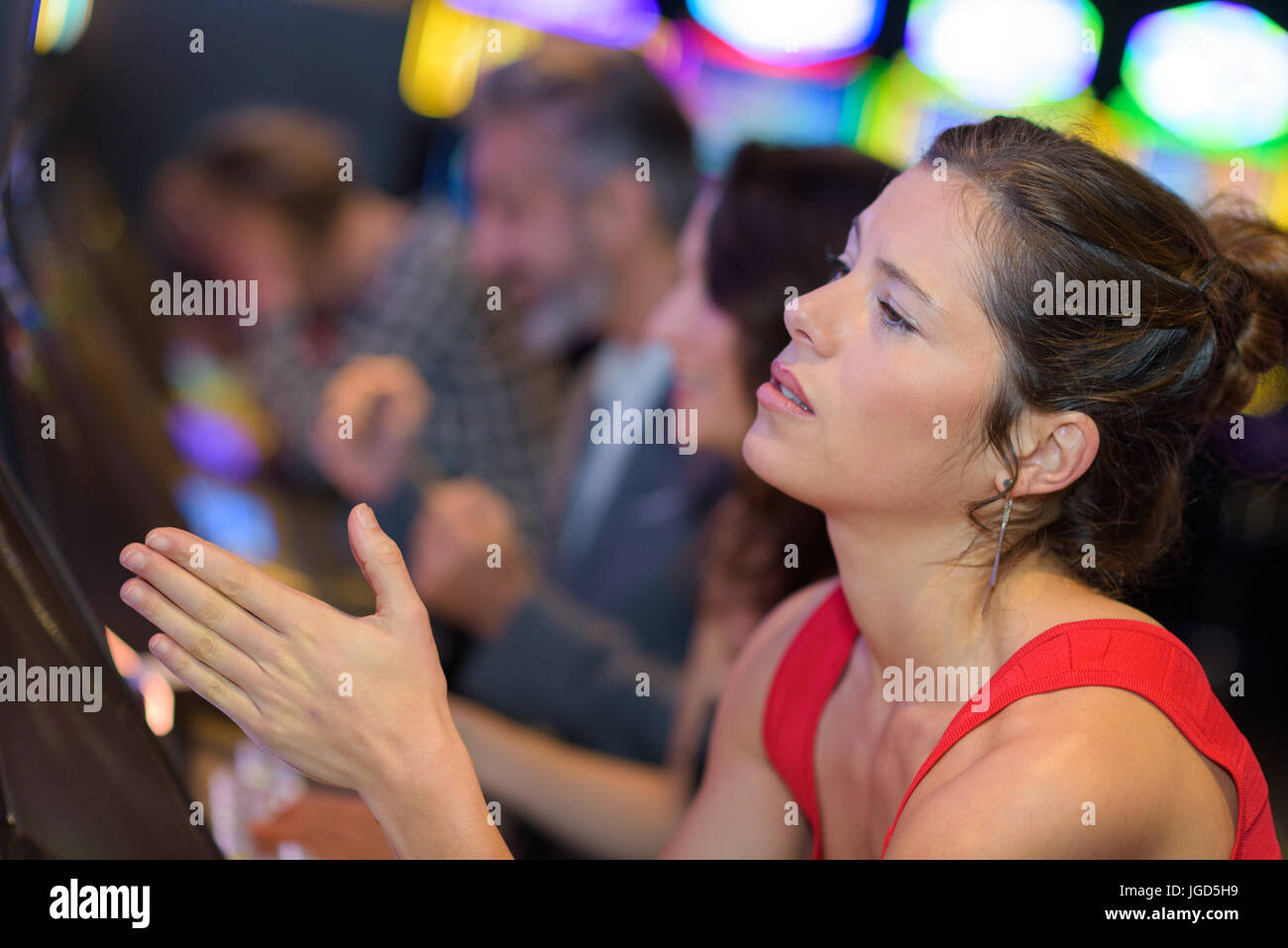 Man and woman playing gaming machine hi-res stock photography and ...