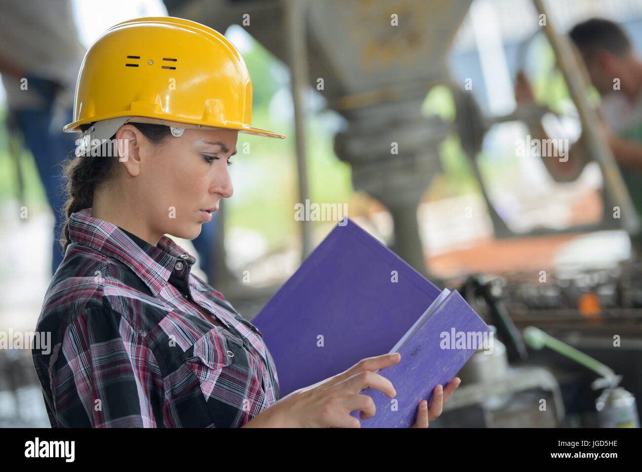 female worker looking up in warehouse Stock Photo - Alamy