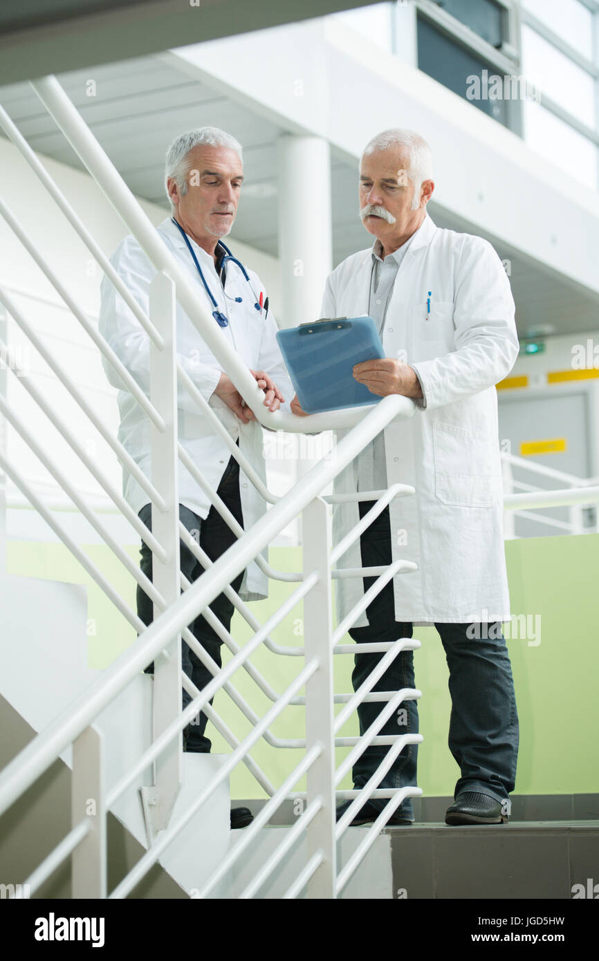 senior doctors climbing up stairs in hospital Stock Photo - Alamy