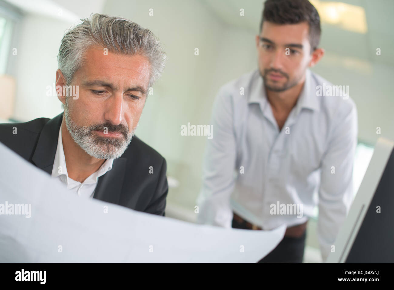 busy architects trying to solve an architectural problem Stock Photo ...