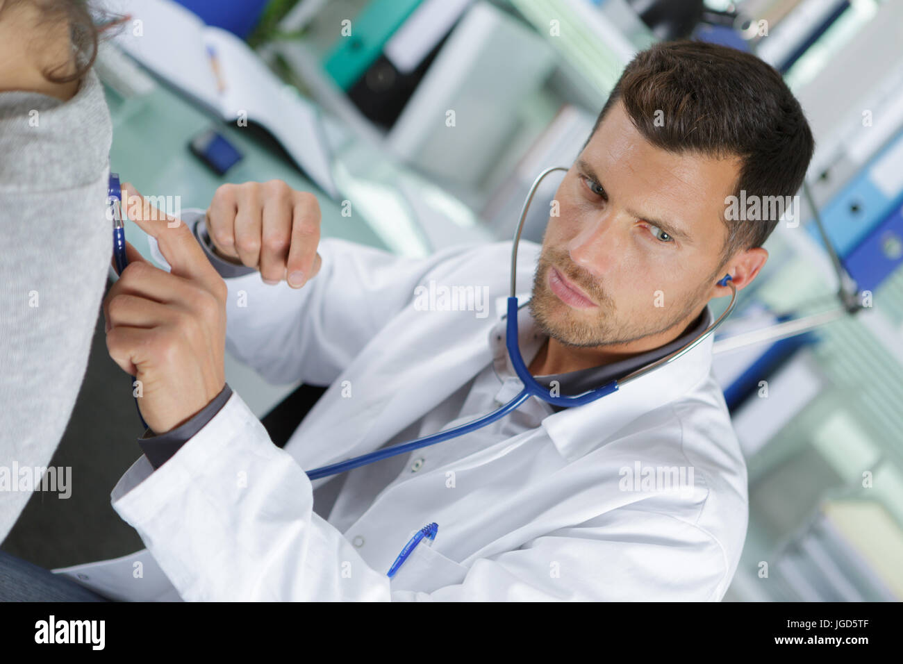 doctor checking male patients back with a stereoscope Stock Photo - Alamy