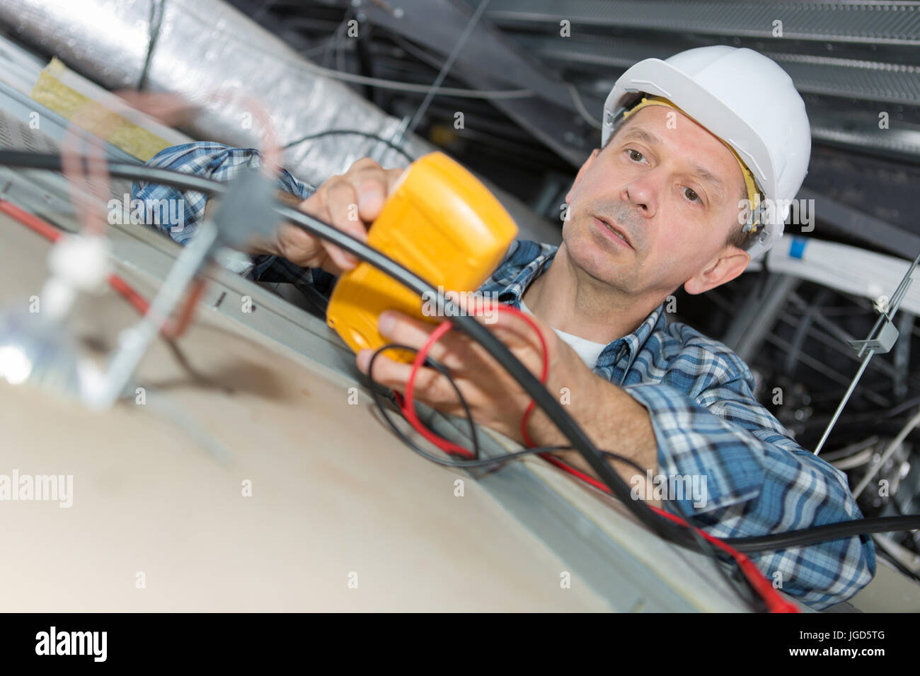 electricians working on an electric meter Stock Photo - Alamy