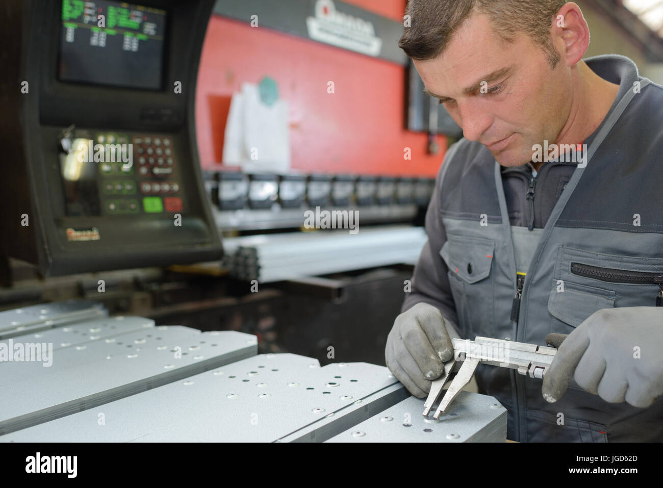 industrial man technician worker checking machine Stock Photo - Alamy