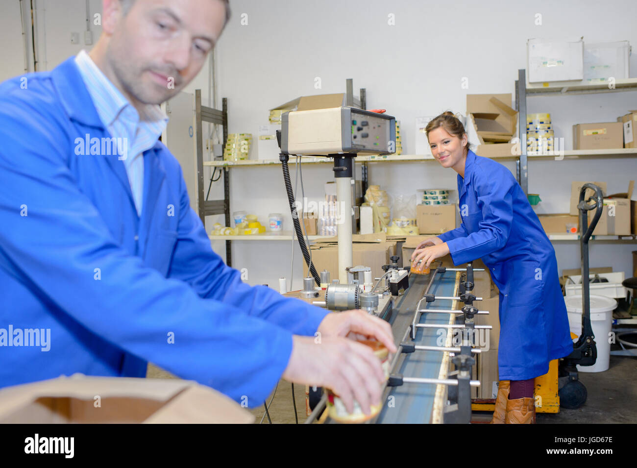 happy workers on a factory line Stock Photo - Alamy
