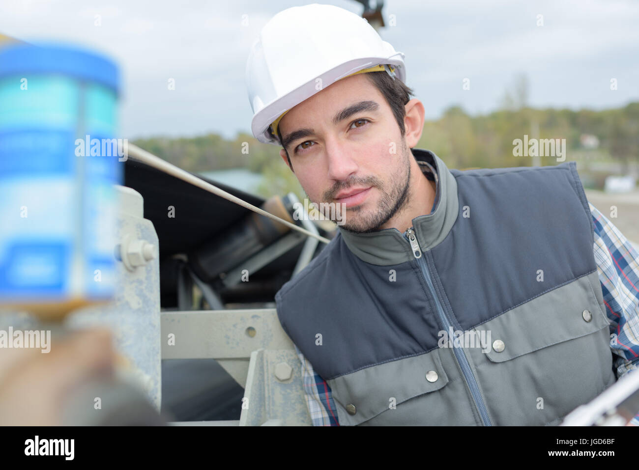 portrait of handsome young construction worker on building site Stock ...