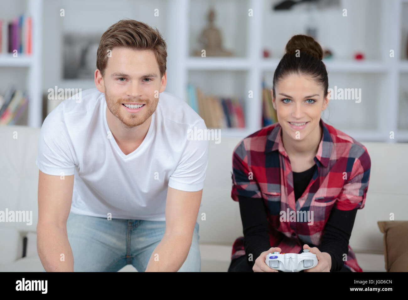 young couple having fun playing videogame at home Stock Photo - Alamy
