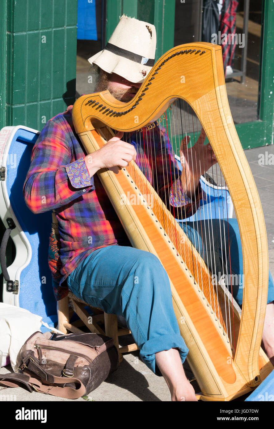 Harpist busker hi-res stock photography and images - Alamy