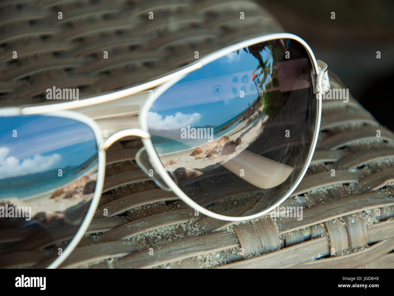 Reflection of a beautiful sea beach in sunglasses Stock Photo - Alamy