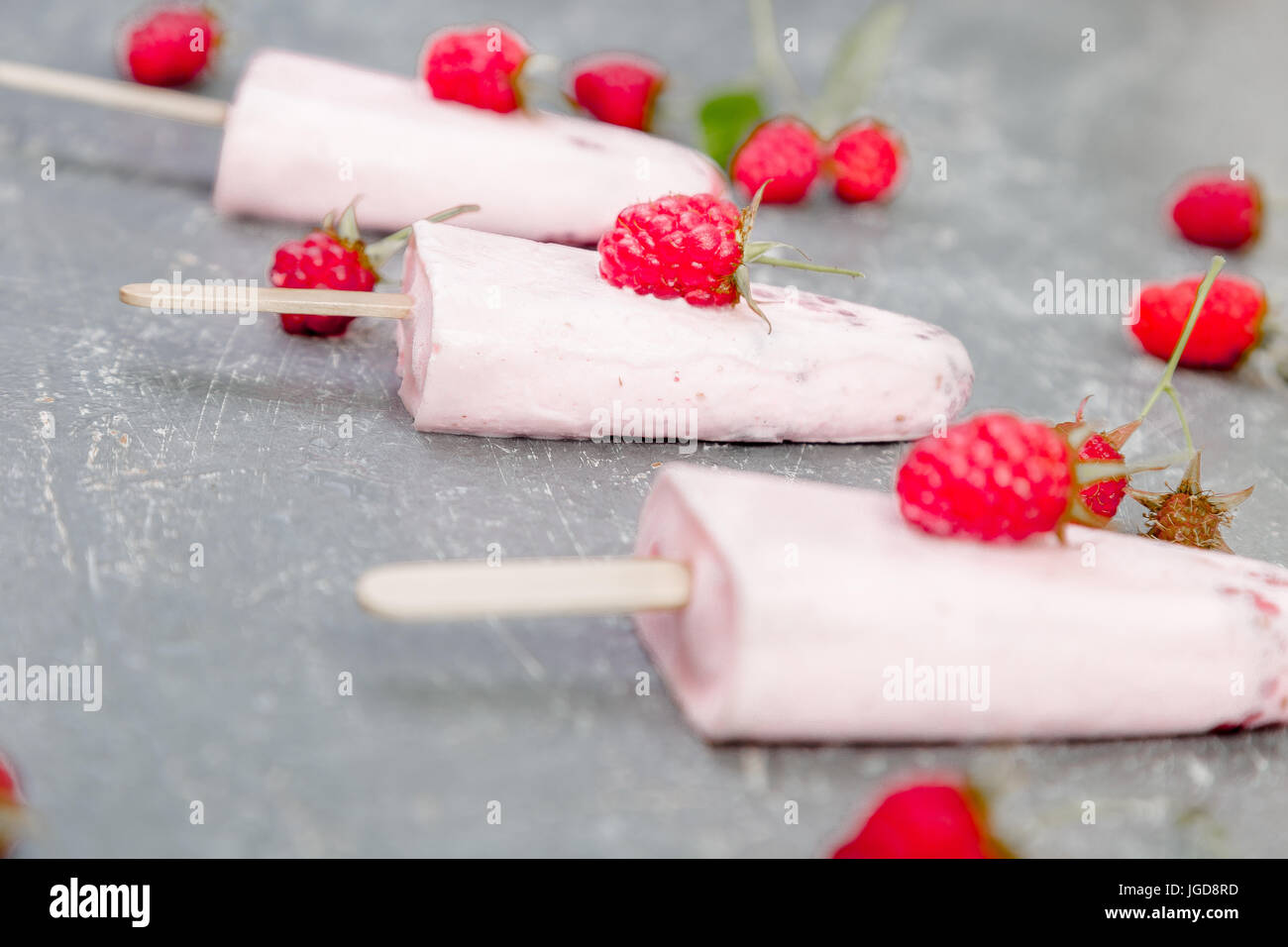 Raspberry ice cream on grey background. Three popsicles. Homemade Stock ...