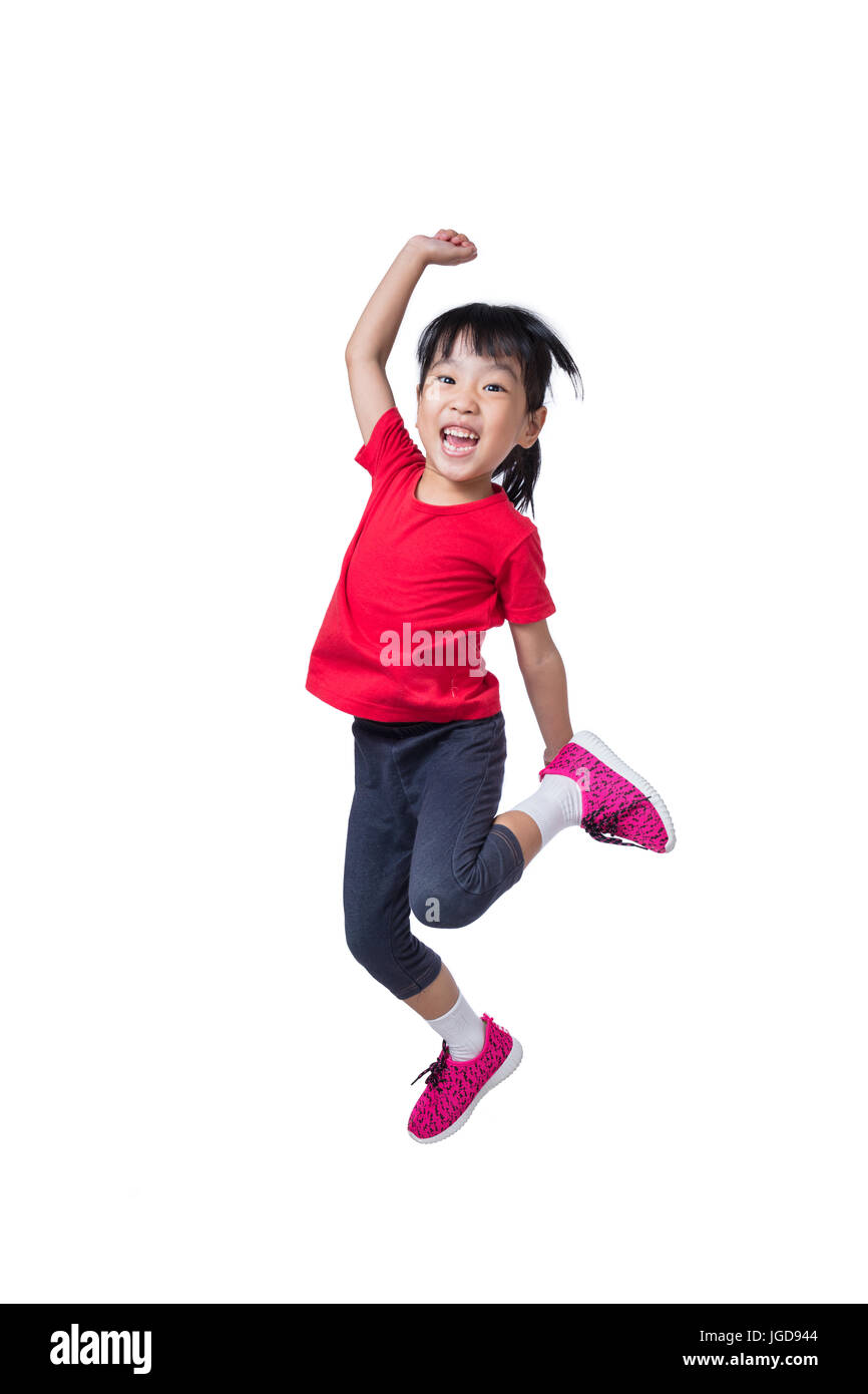 Asian Chinese little girl jumping up and wave her hands in isolated ...