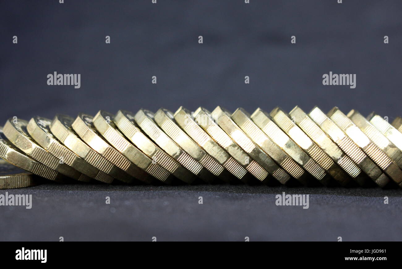 A neat horizontal line of new British pound coins, July 2017, UK Stock ...