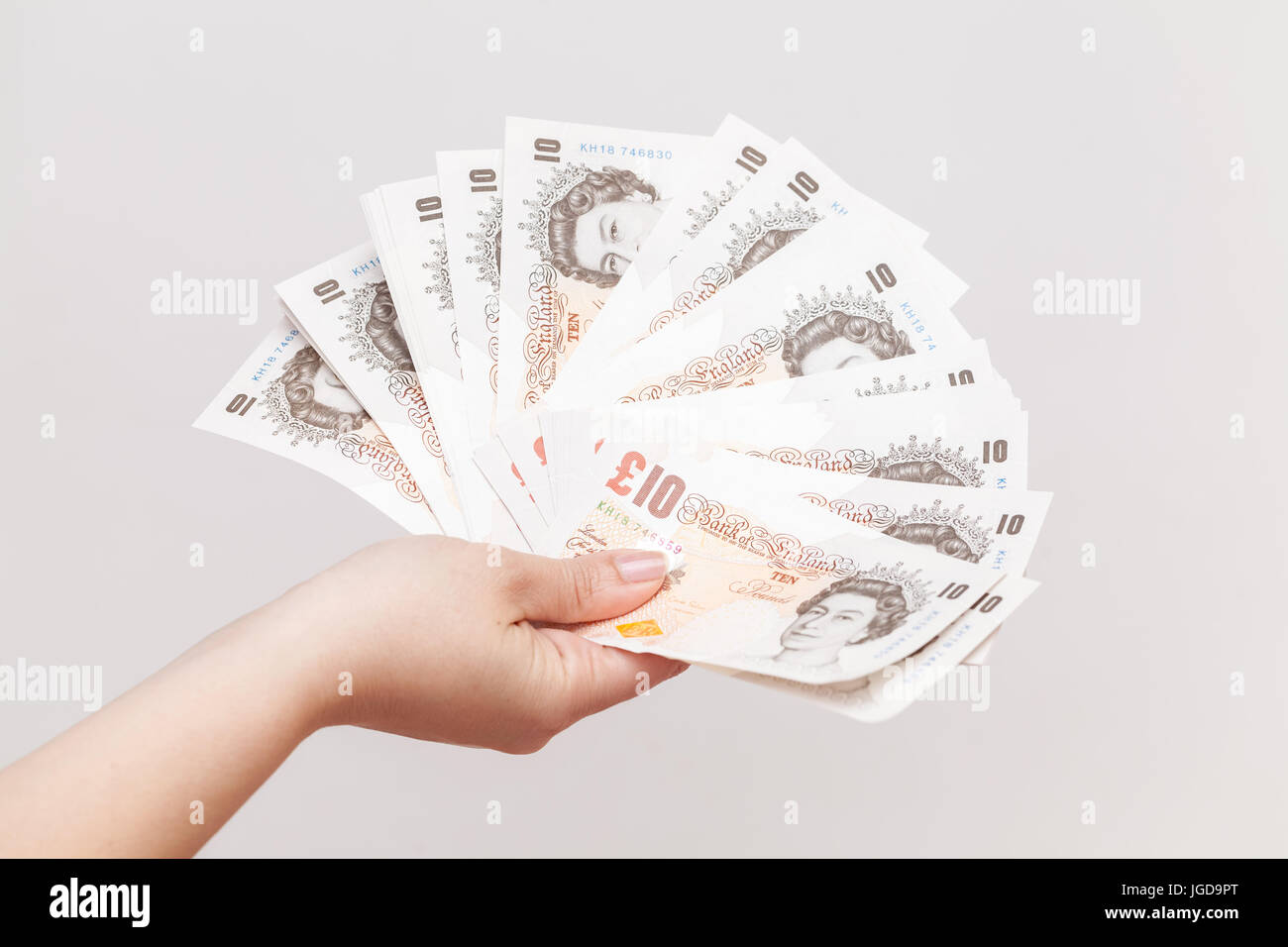Ten pound note and hand hi-res stock photography and images - Alamy