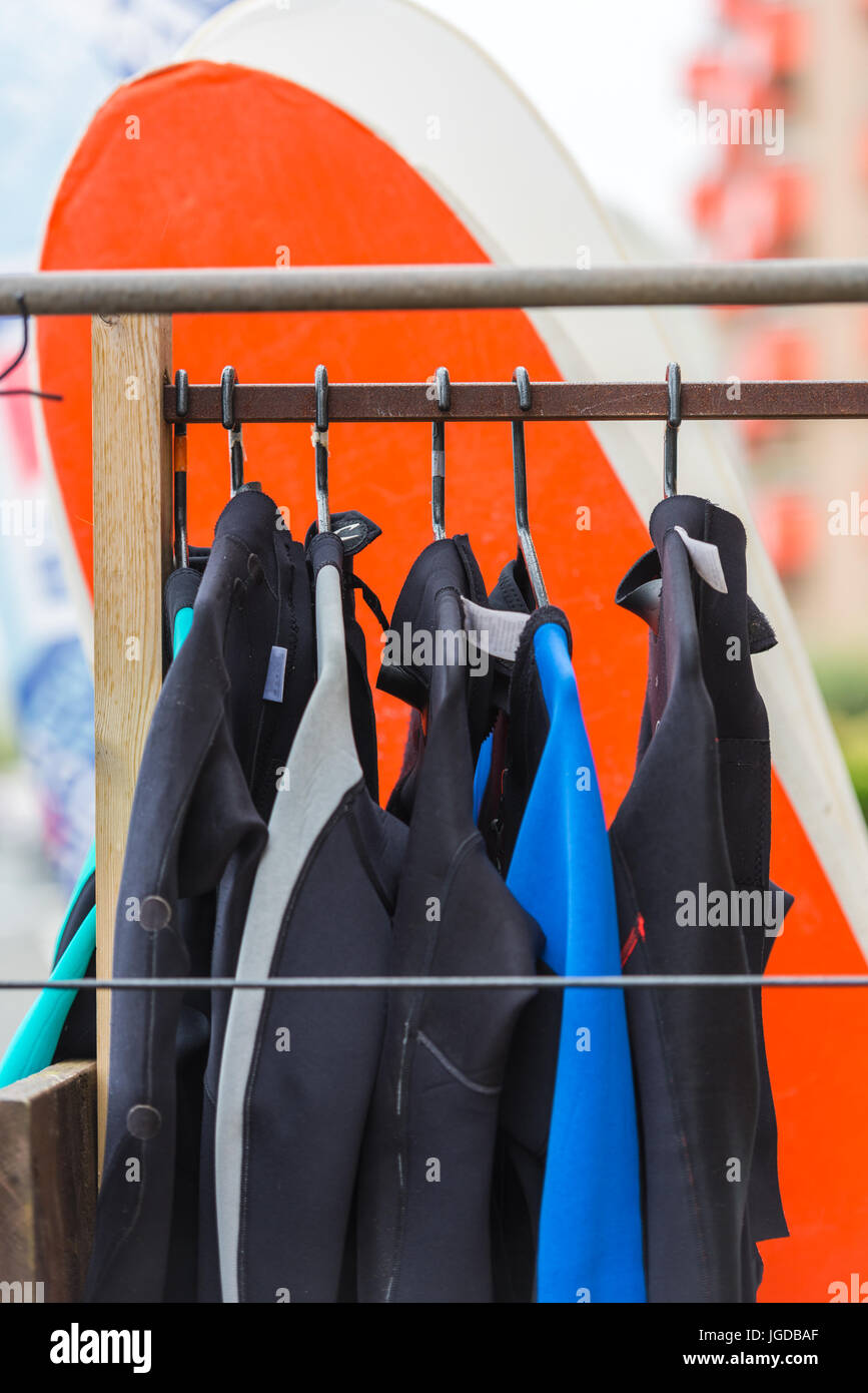 Diving suits and surf boards in a store. France Stock Photo - Alamy