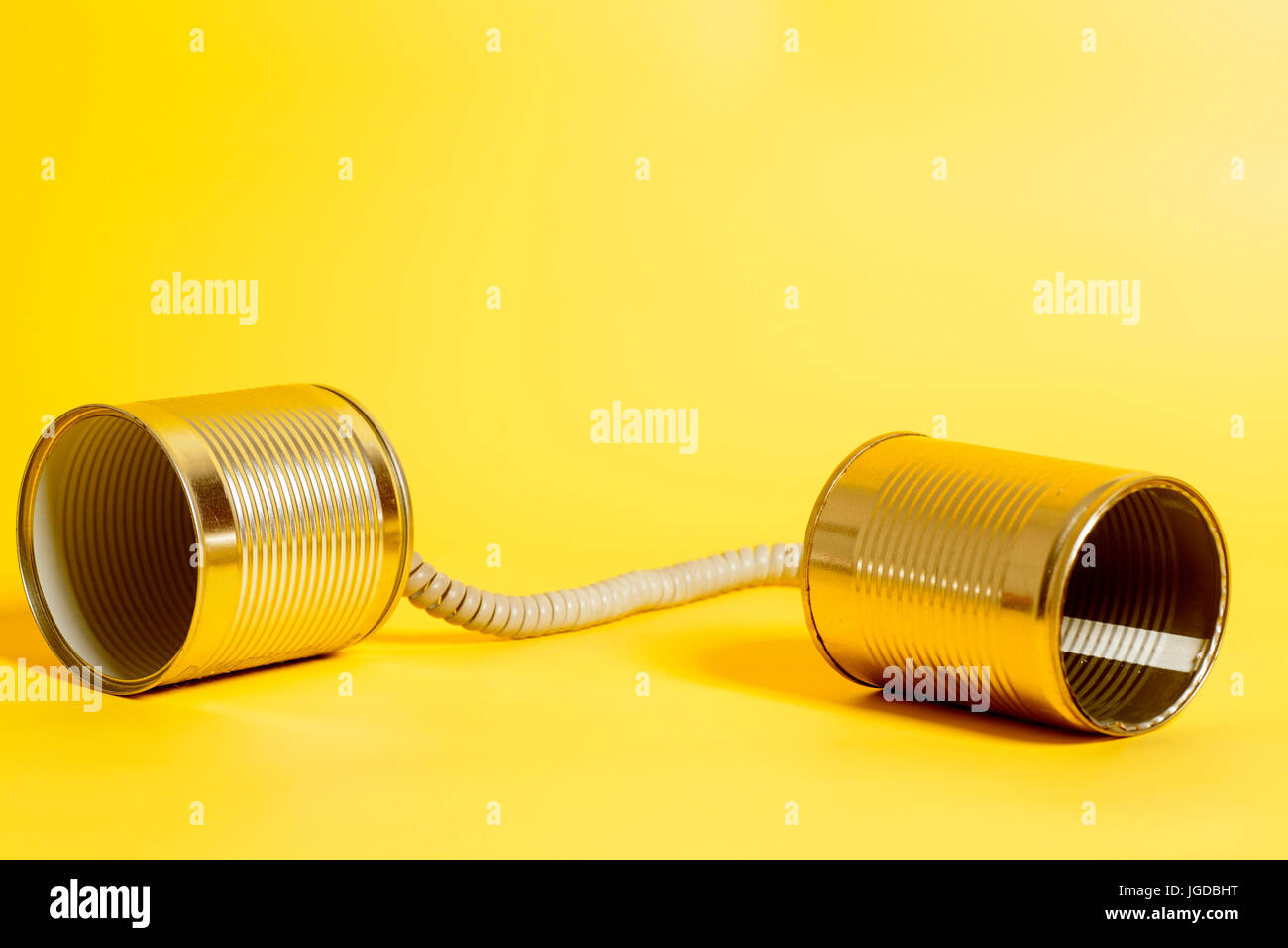 Tin can phone. Communication concept Stock Photo - Alamy