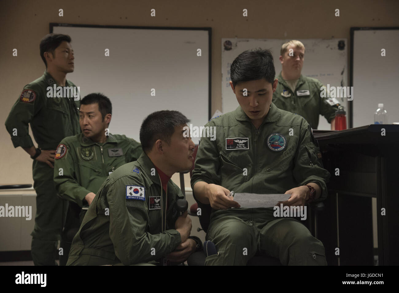 Republic of Korea Air Force (ROKAF) Capt. Yeo Myeonghwan, center left ...