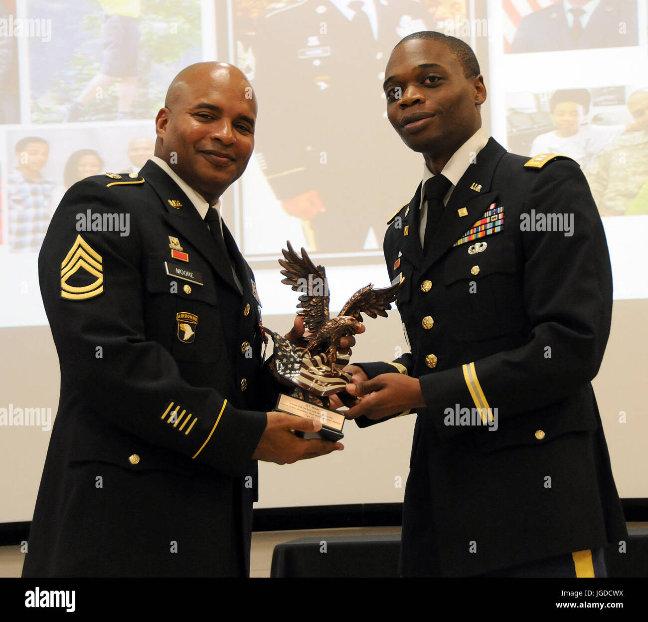 Capt. Eric Moton (right), chief, Finance Division for the U.S. Army ...