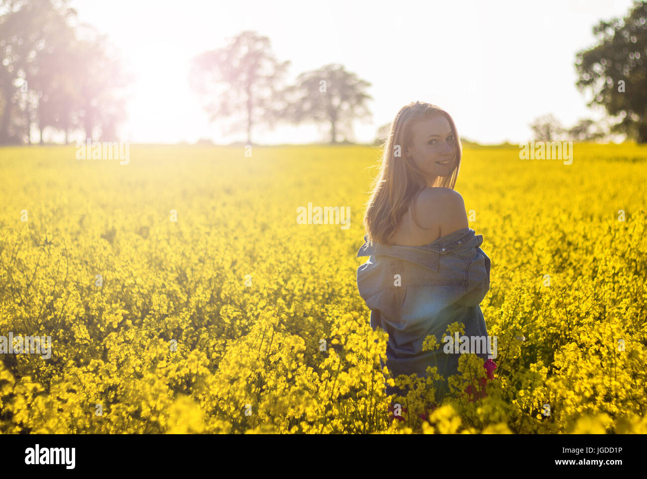 Lost girl in flower field Stock Photo - Alamy