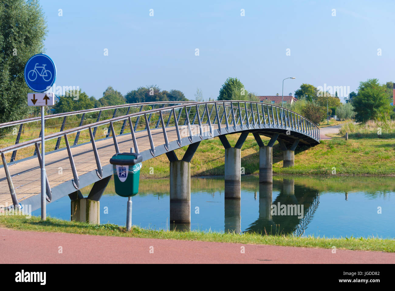 small bicycle bridge over a canal Stock Photo - Alamy