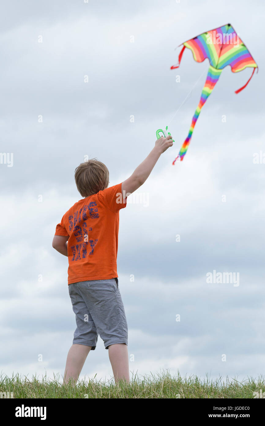 young boy flying kite Stock Photo - Alamy