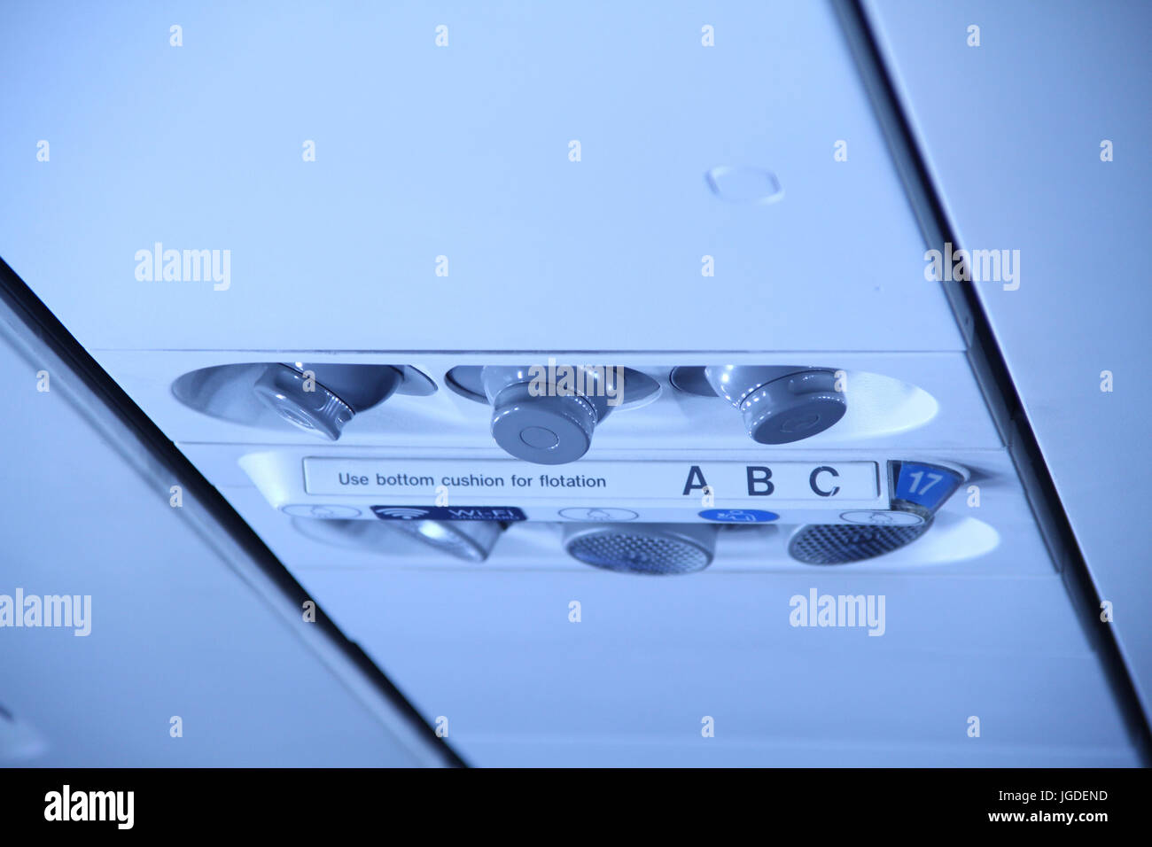 Airplane cabin luggage rack hi-res stock photography and images - Alamy