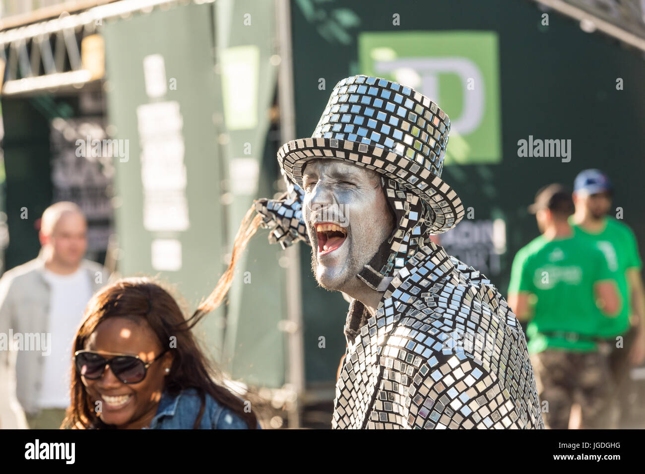 Montreal, 3 July 2017: Mime artist wearing a costume made of small ...