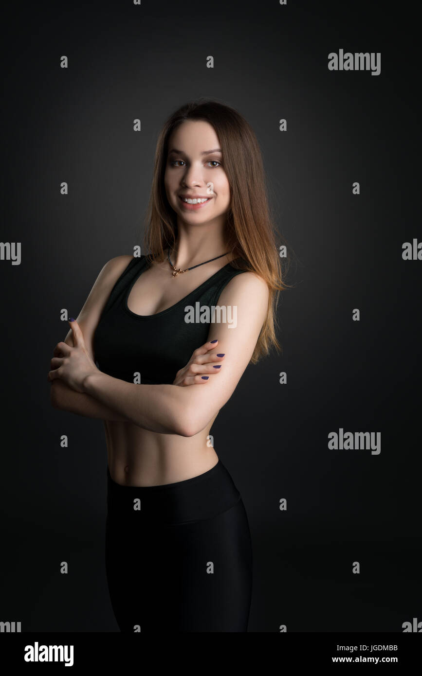 Pretty slim fitness trainer posing in studio Stock Photo - Alamy
