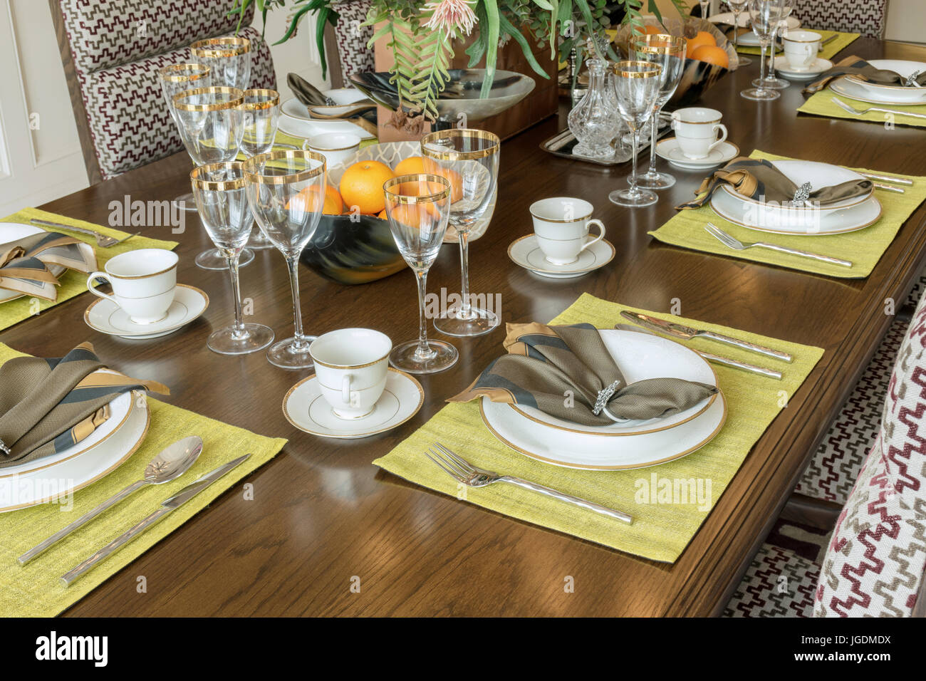elegant table set in modern style dining room interior Stock Photo - Alamy
