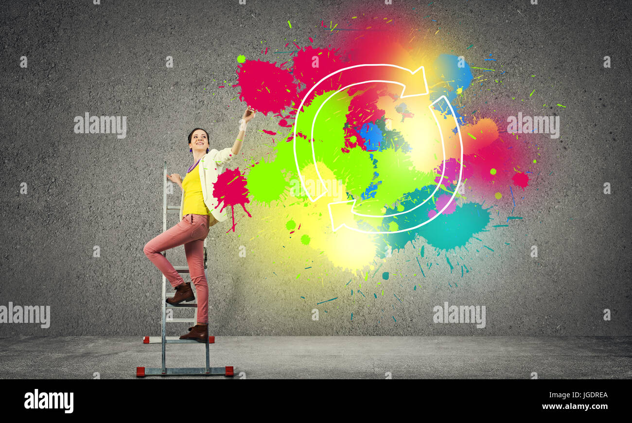 Girl paint wall in colors Stock Photo - Alamy