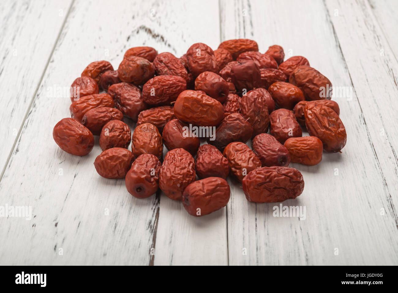 dried jujube on white wood traditional chinese herbal medicine Stock ...