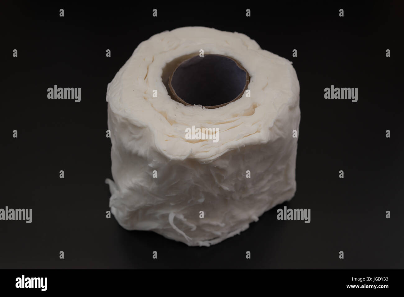 wet tissue roll on a black background Stock Photo - Alamy