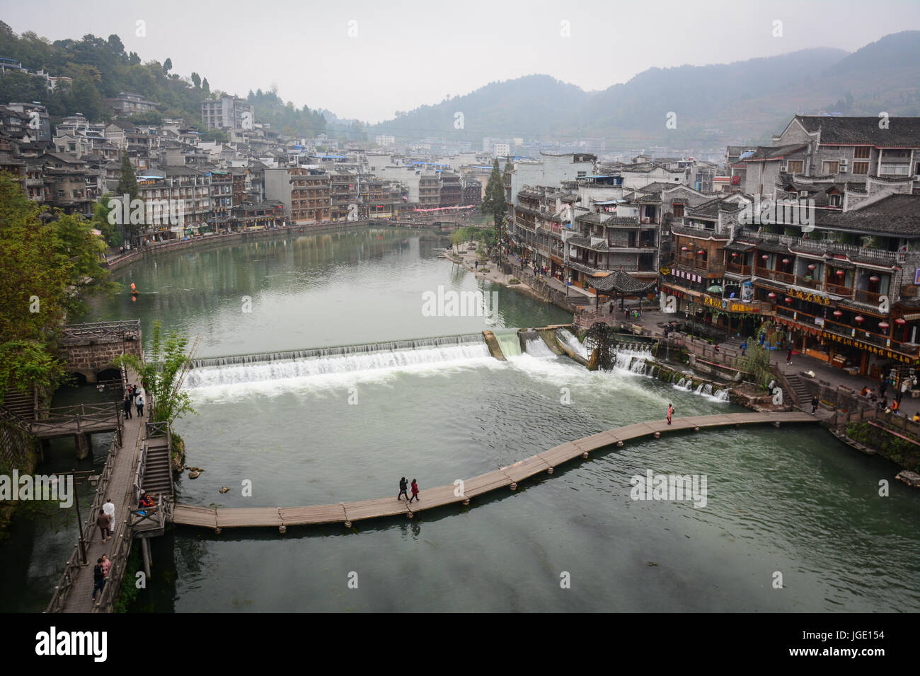 Hunan, China - Nov 6, 2015. Wooden bridge at Fenghuang Ancient Town in ...