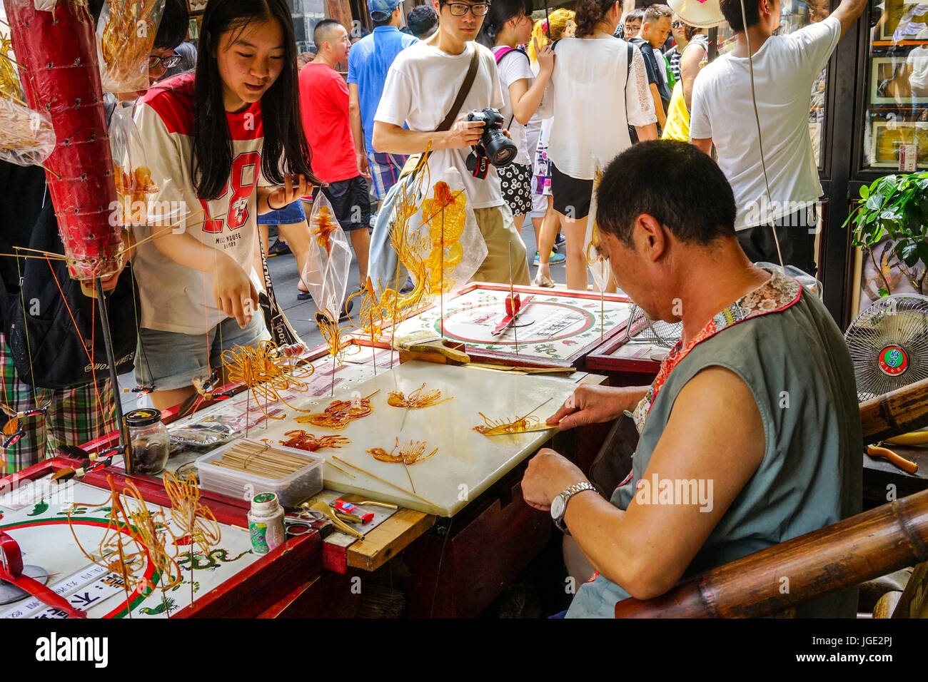 Buying chinese souvenirs china hi-res stock photography and images - Alamy