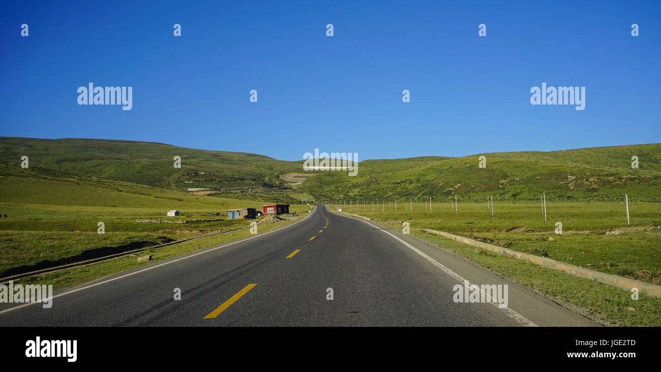 Mountain scenery with highway in Kham Tibetan, Sichuan, China. Kham is ...