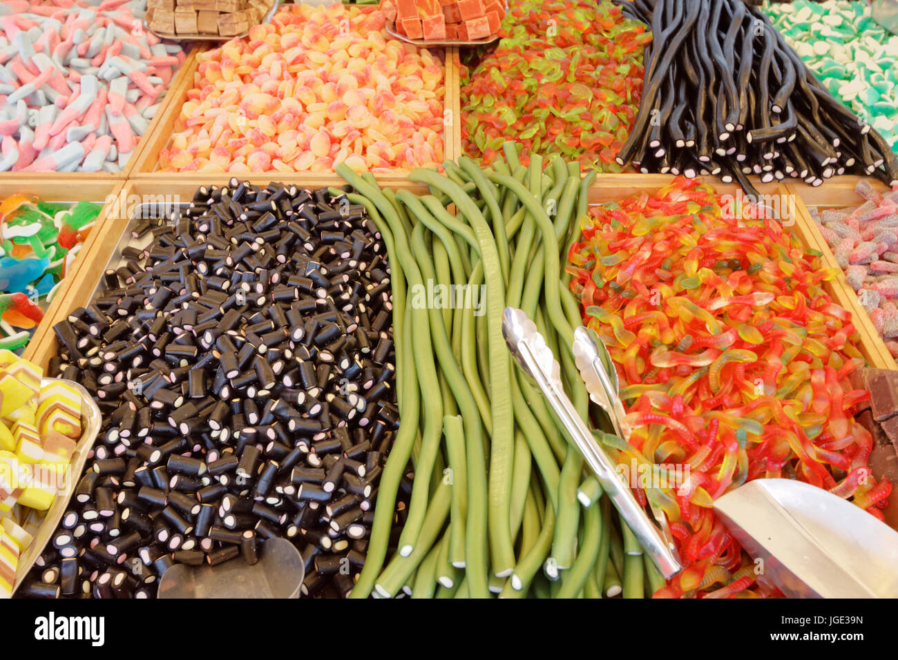 colorful selection of sweets or candy colourful market stall choice of ...