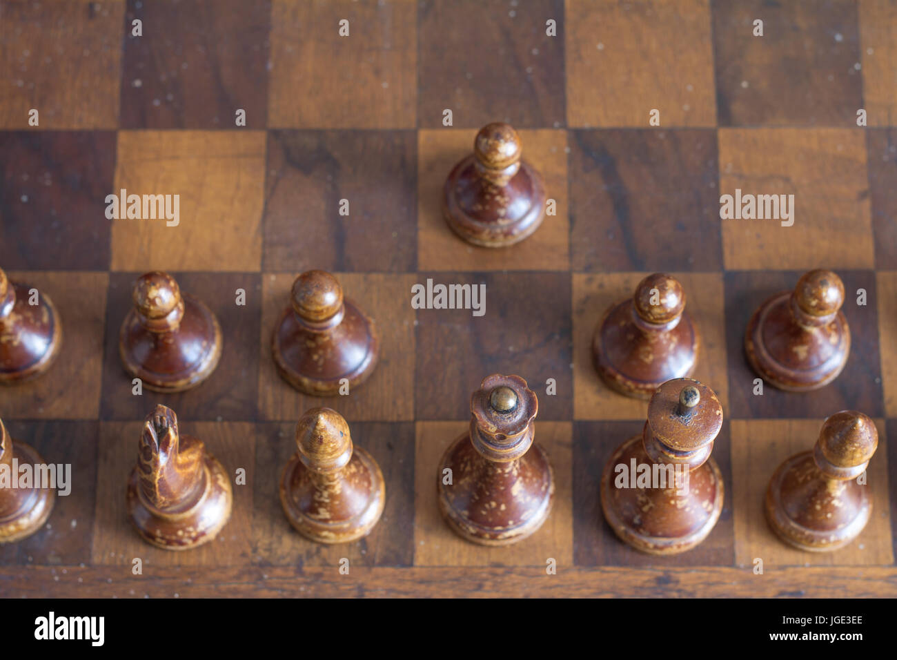 Ancient wooden chess pieces on an old chessboard Stock Photo - Alamy
