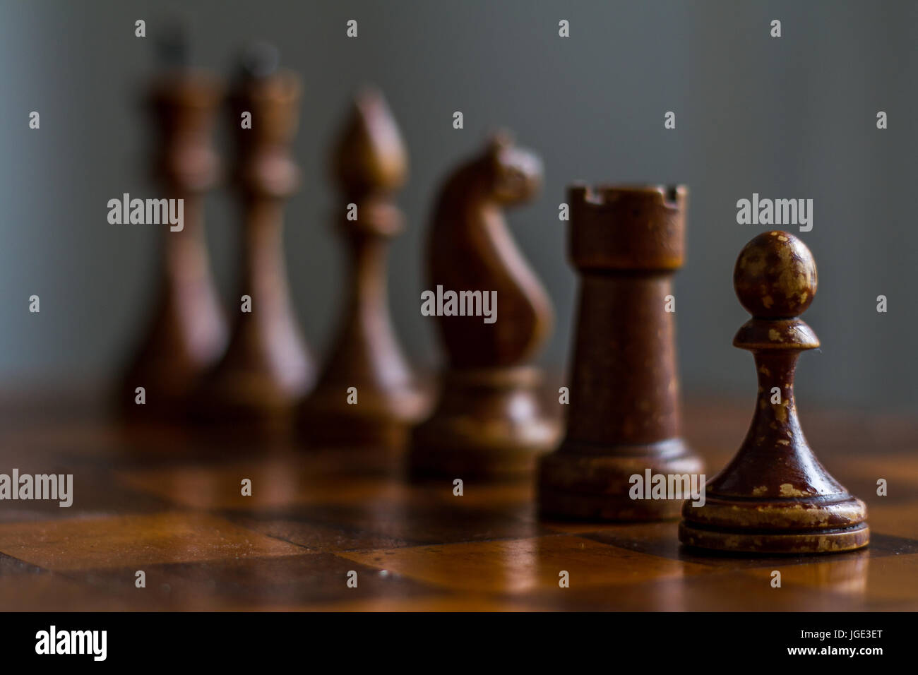 Ancient wooden chess pieces on an old chessboard Stock Photo - Alamy