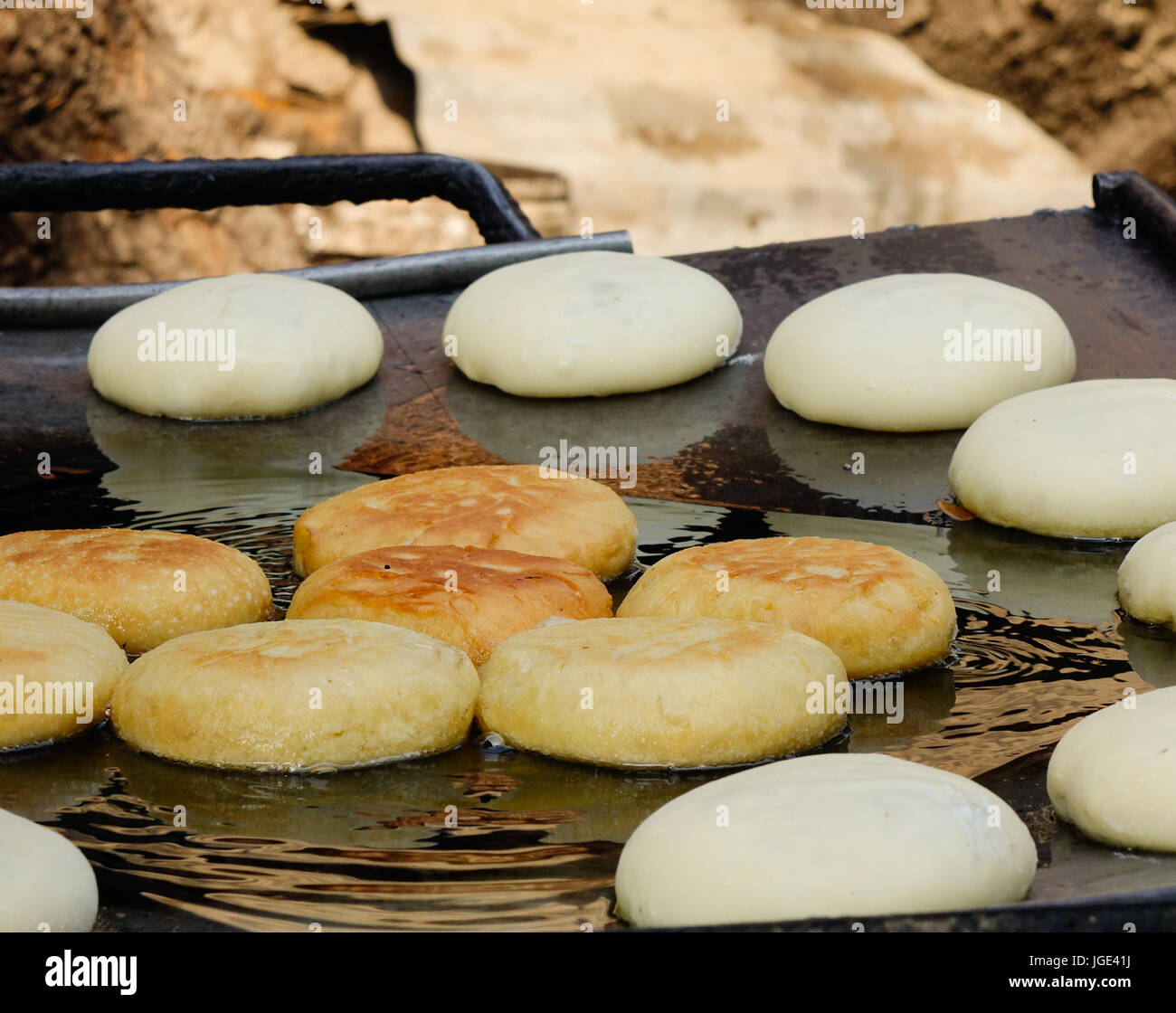 Making fried wheat flour cake on street in Yangon, Myanmar Stock Photo ...